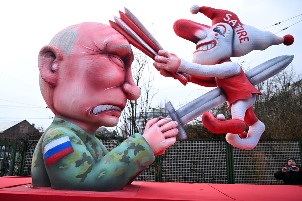 German Carnival parades heap satire on Putin, Trump, domestic leaders ...
